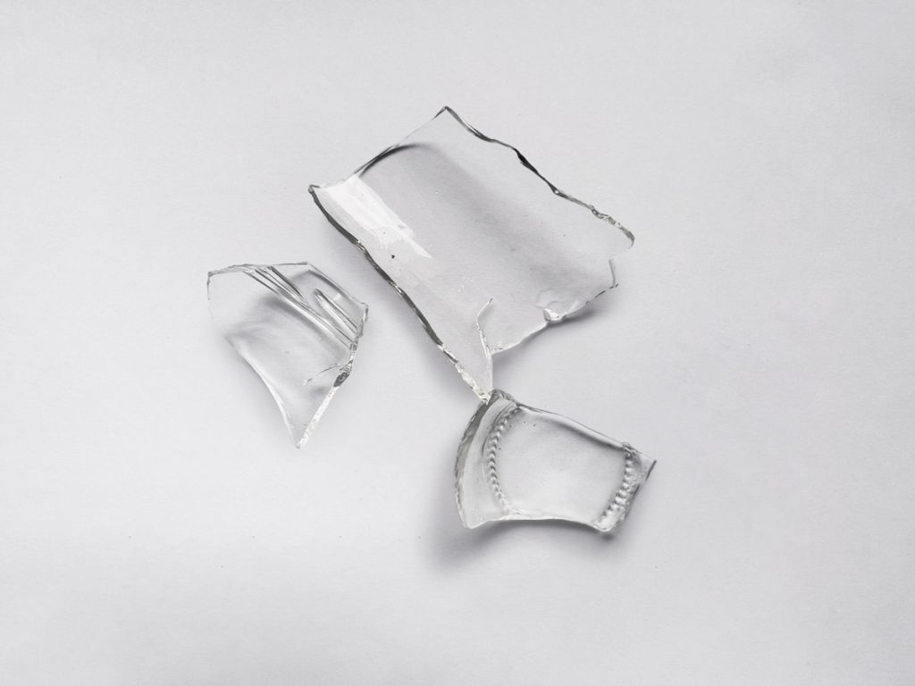 Broken glass pieces on white background - Pixcrafter
